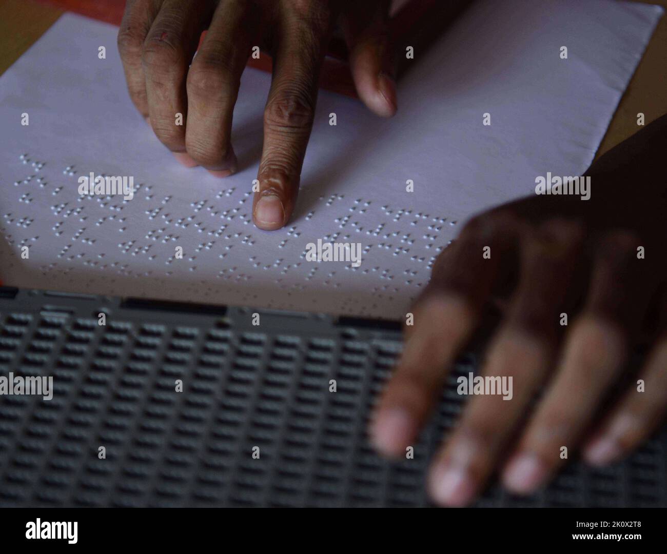 Visually impaired students studying during a special class on the eve ...
