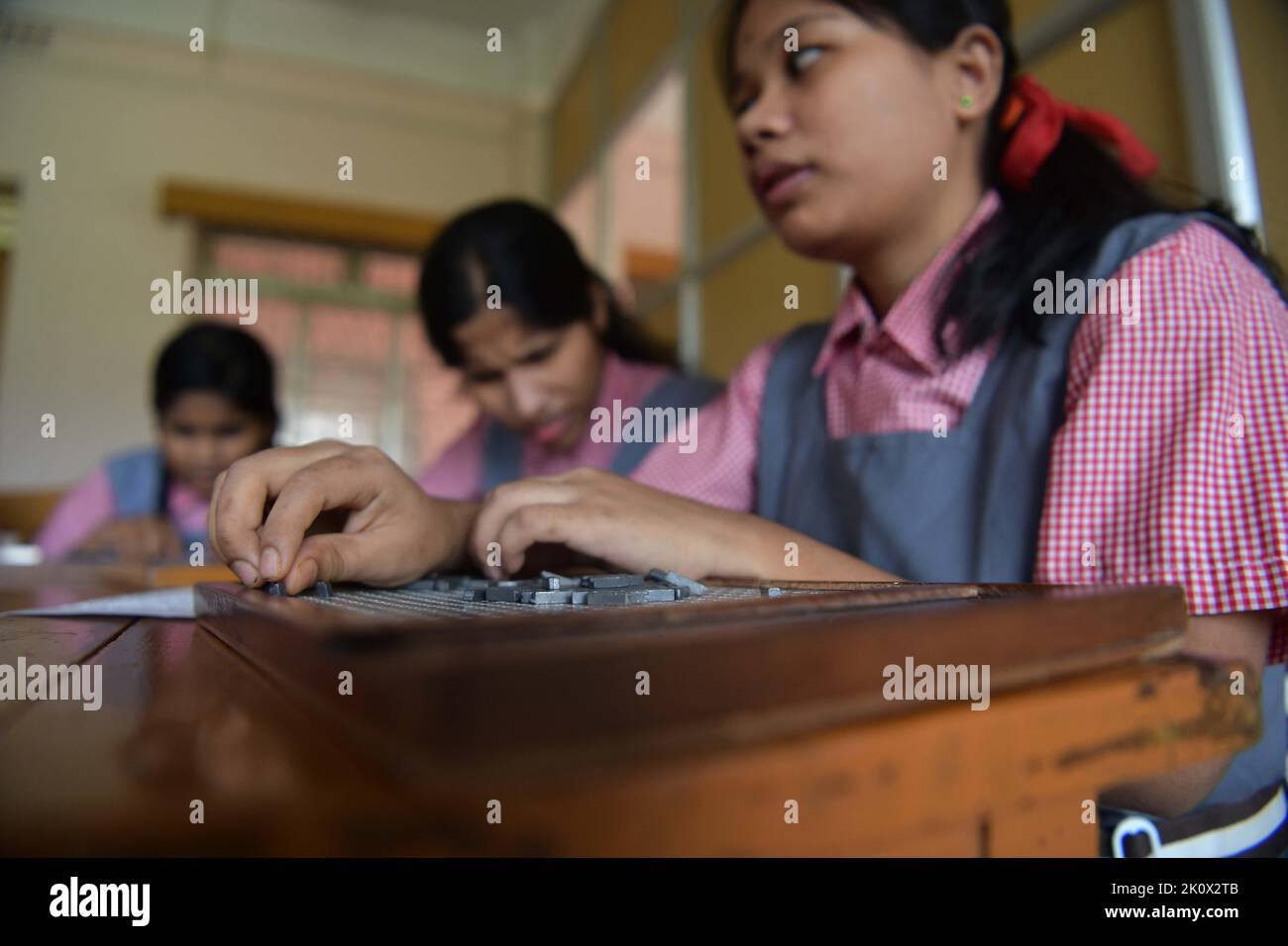 Visually impaired students studying during a special class on the eve ...