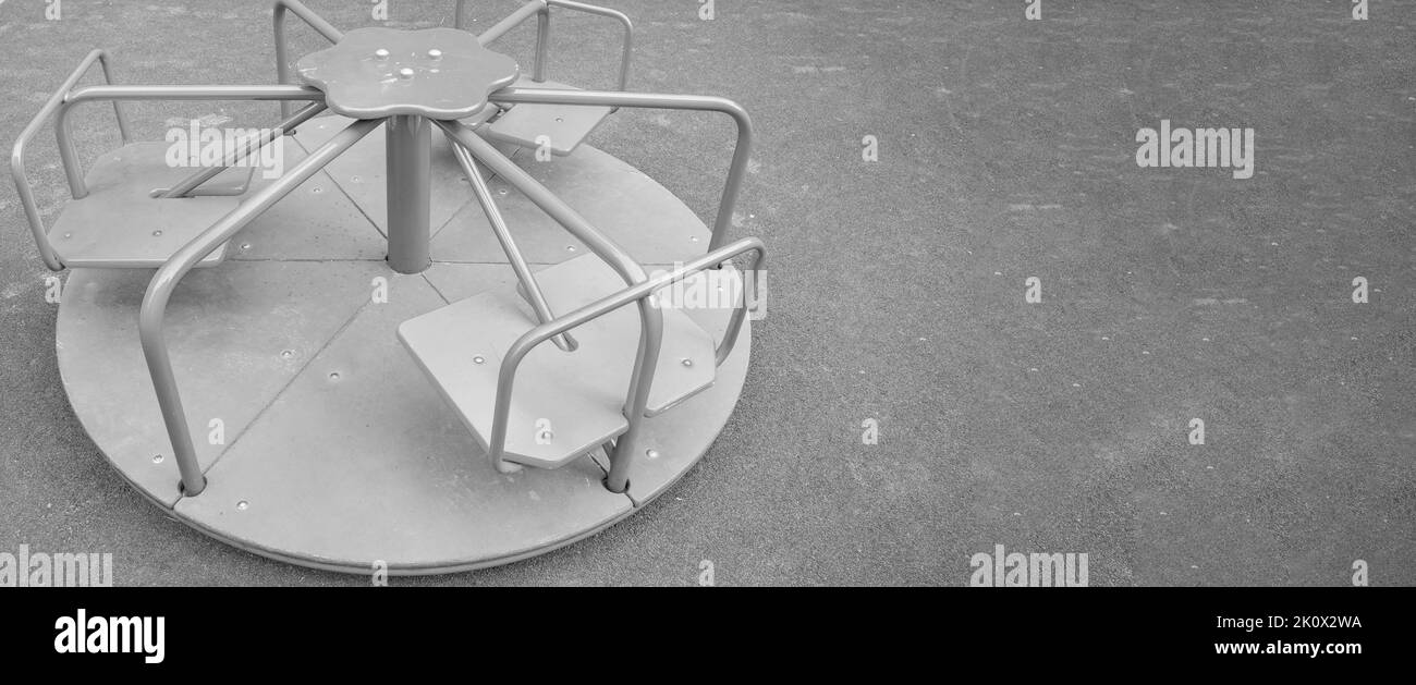 Steel round carousel on the playground, copy of the space on the right ...