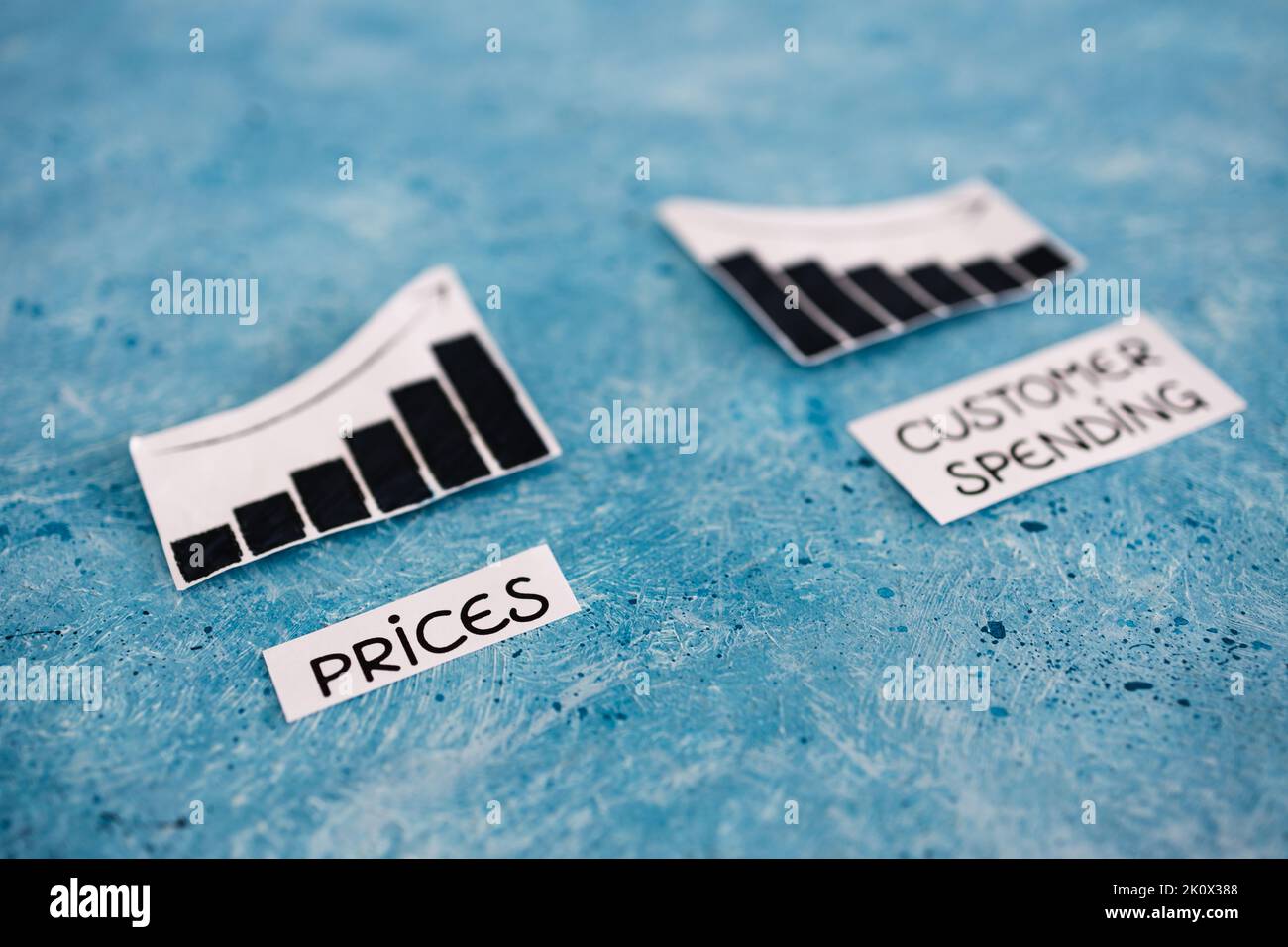 prices going up and consumer spending going down conceptual image ...