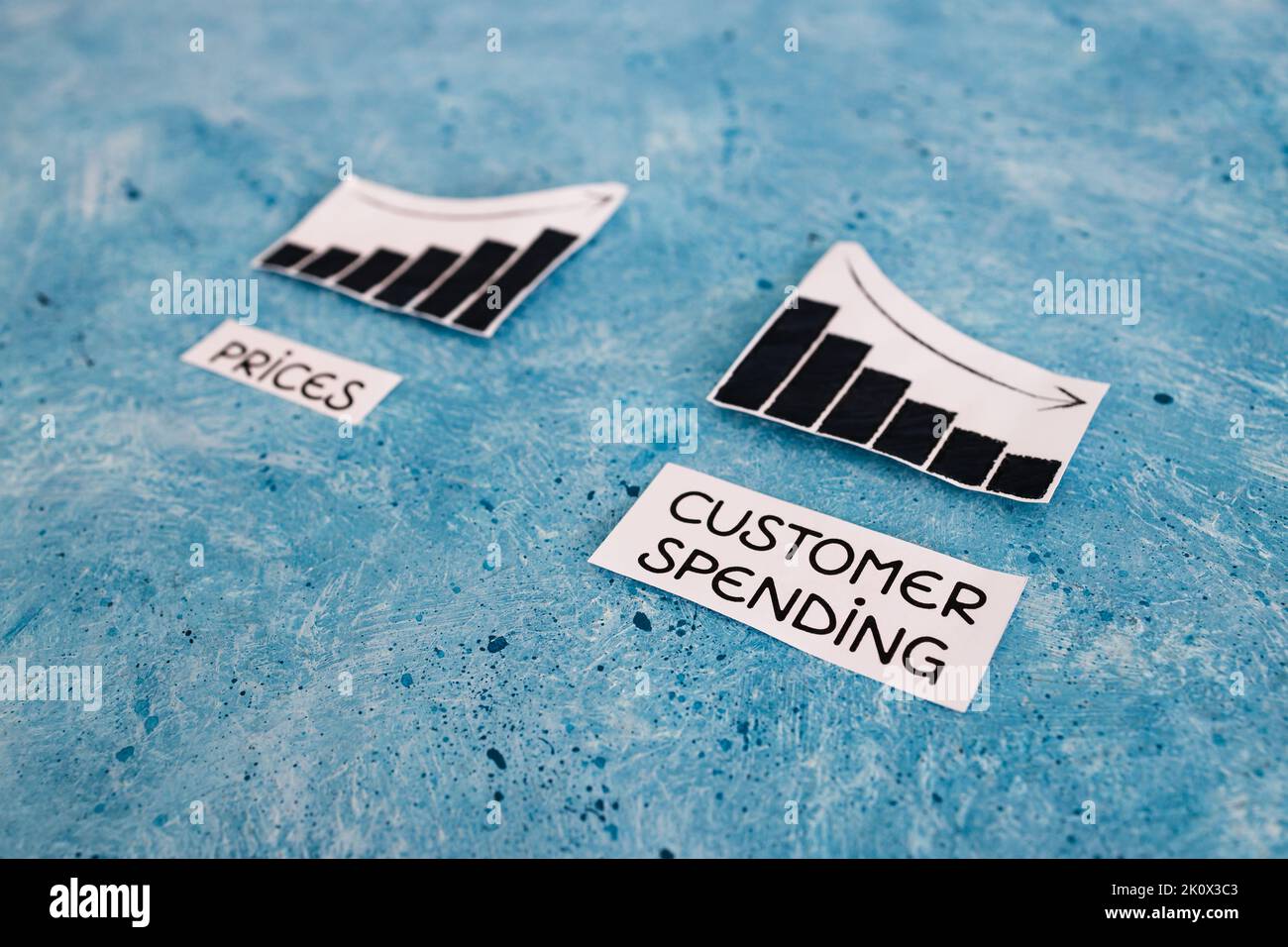 prices going up and consumer spending going down conceptual image ...
