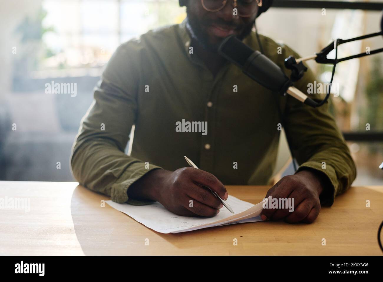 Close-up of young black man pointing at paper with questions for ...