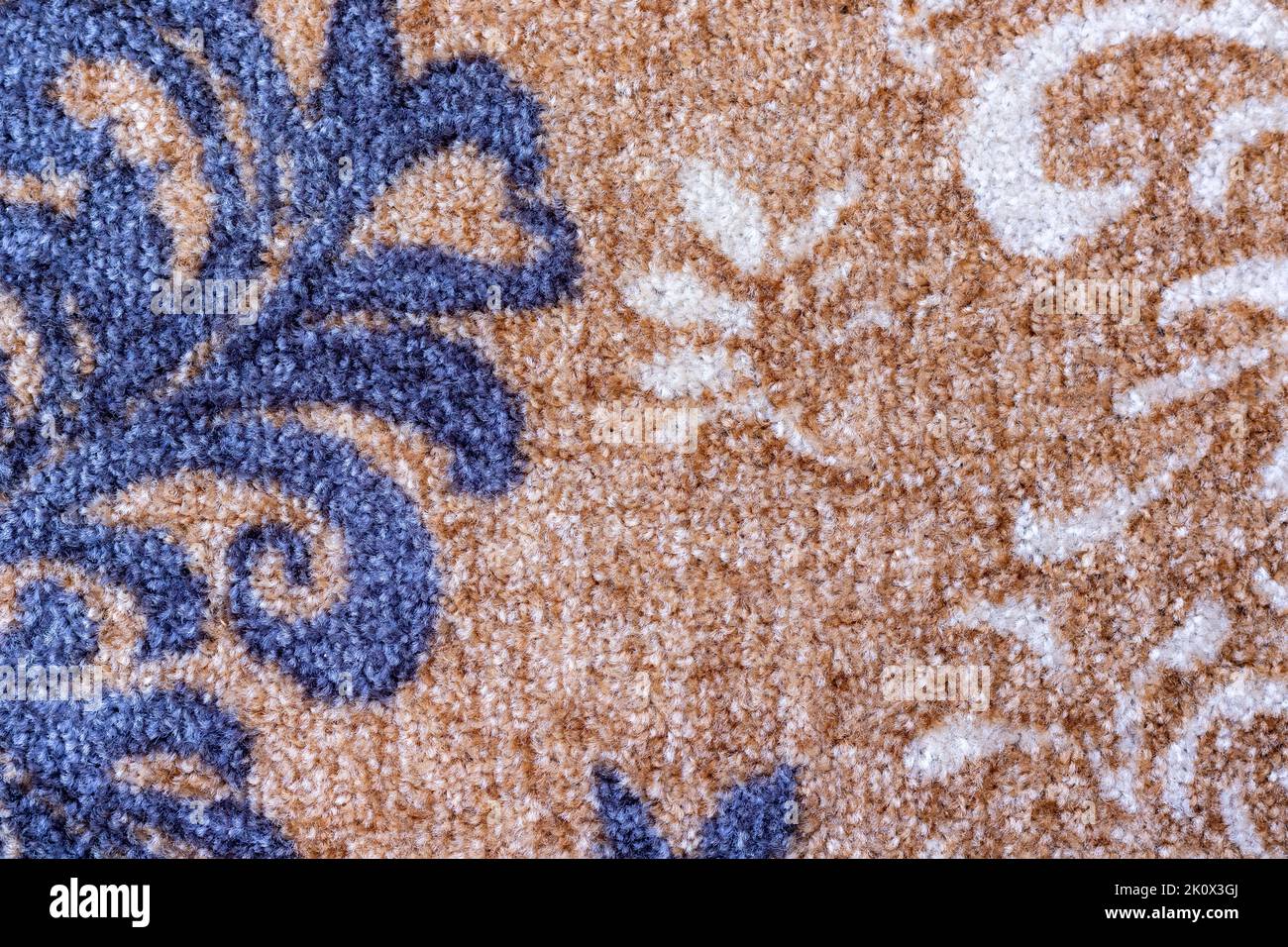 Light brown color carpet with blue and white color design texture ...