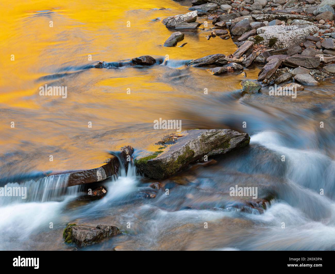 Autumn colors reflect on the Little River in the Great Smoky Mountains ...