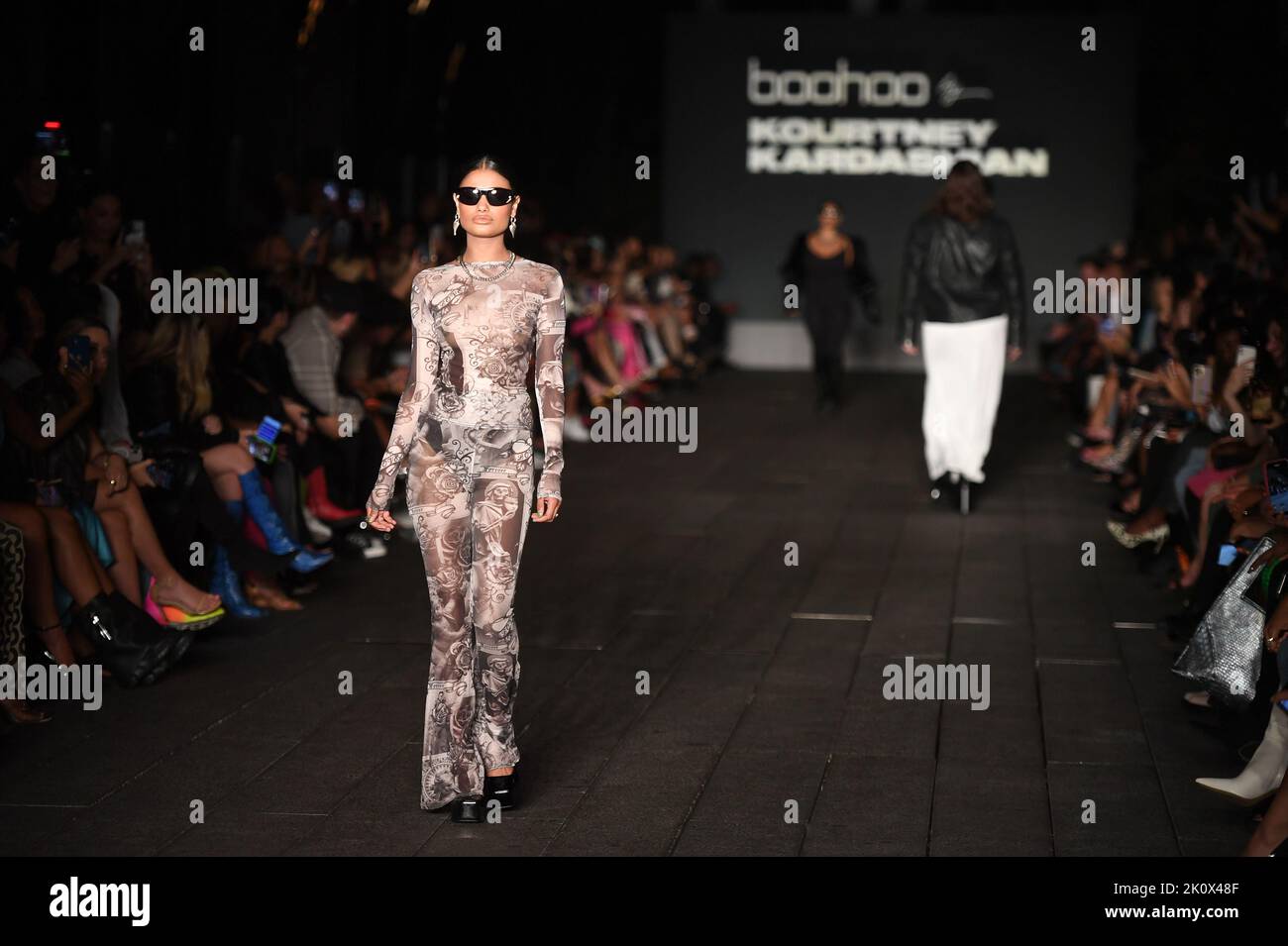 New York, USA. 13th Sep, 2022. Models walk the runway at the Boohoo X Kourtney Kardashian ...