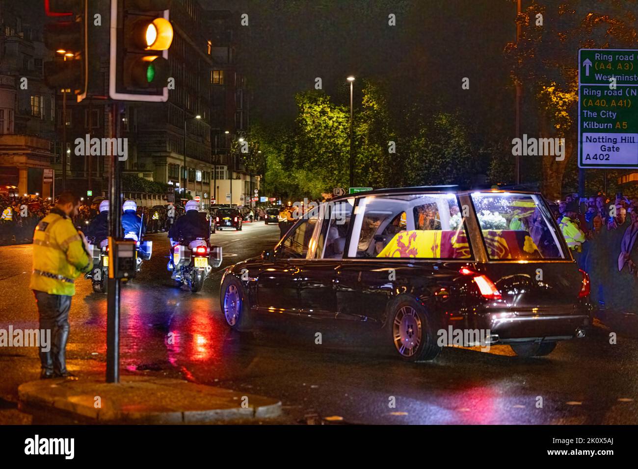 The state hearse of Queen Elizabeth II passes through the crowds at ...