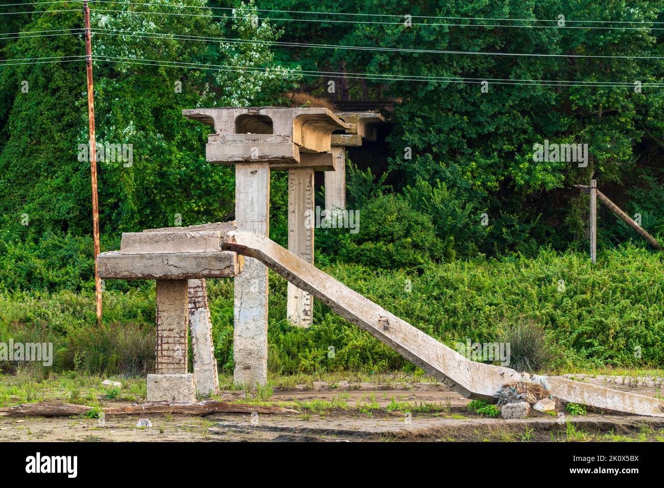Remains of an old stone bridge on the beach Stock Photo - Alamy