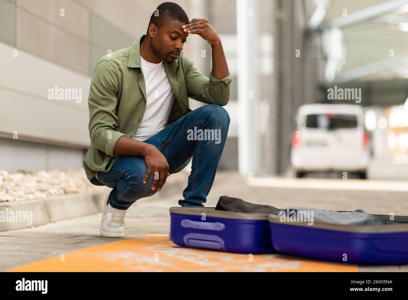 Unhappy Black Male Tourist Having Problem With Luggage At Airport Stock ...
