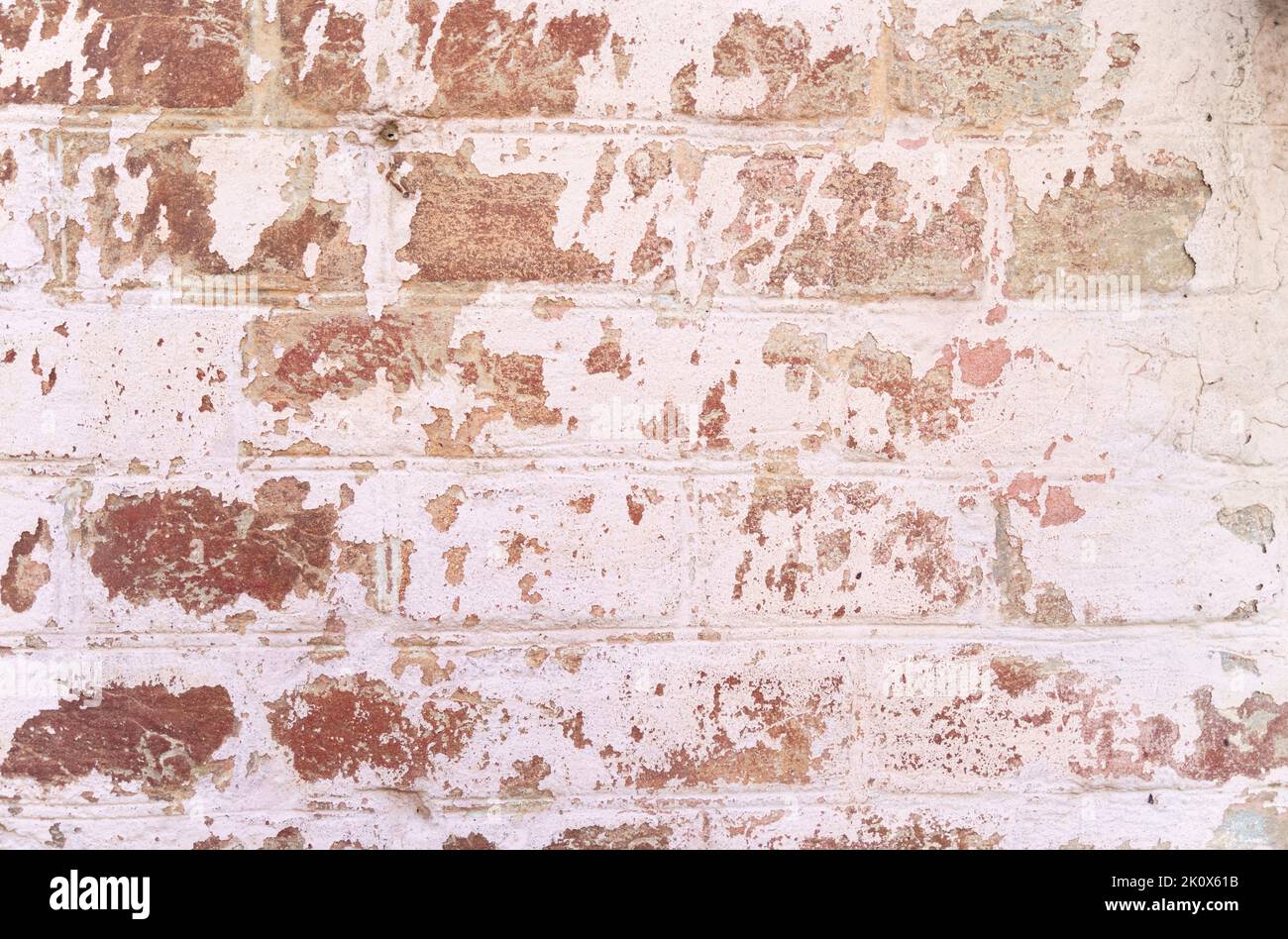 Background texture of a brick wall with old white crumbling paint ...