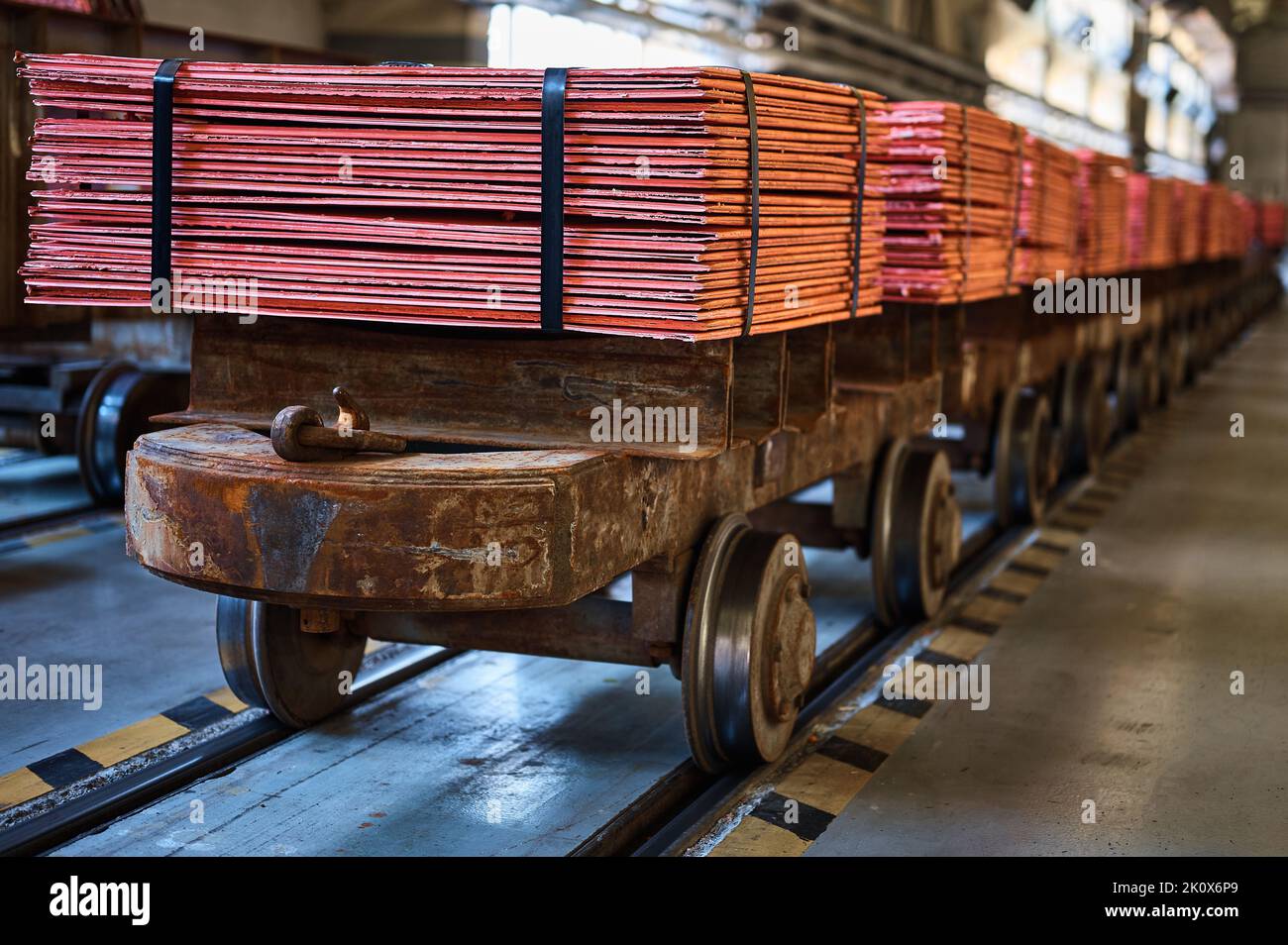 Cathode copper sheets on rail carriages in warehouse Stock Photo - Alamy