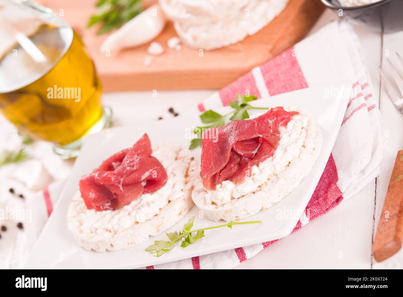 Rice cakes with milk flakes and cold beef Stock Photo - Alamy