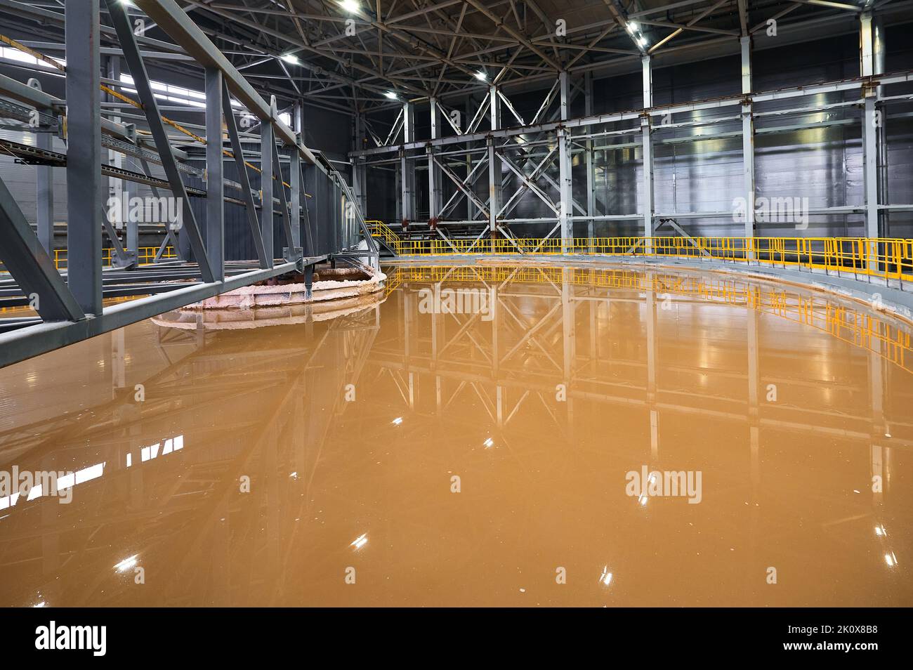 Huge container to separate liquid pulp material in workshop Stock Photo ...