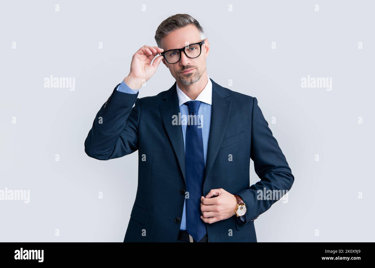 mature ceo wear businesslike suit and eyeglasses on grey background ...