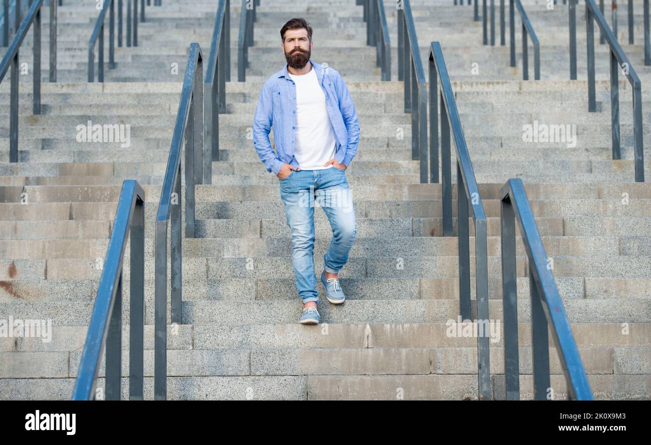 bearded man walking downstairs. full length of man with beard. hipster ...