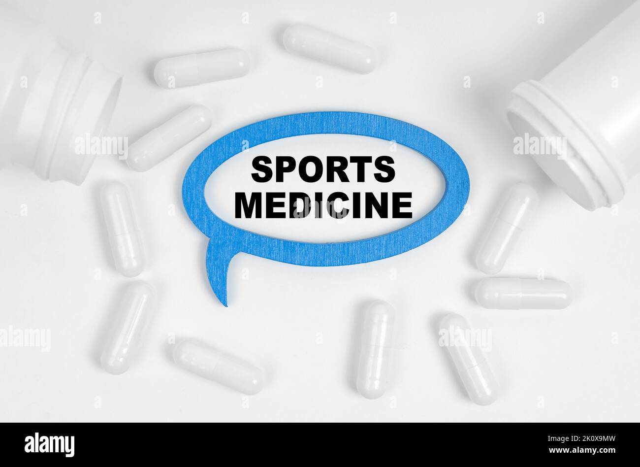 Medicine concept. On the table there are pills and a blue plaque inside ...