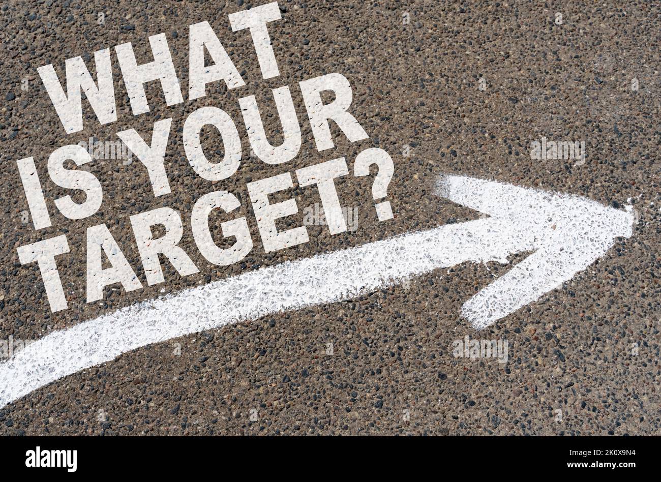 Business concept. On the asphalt road markings an arrow with the ...