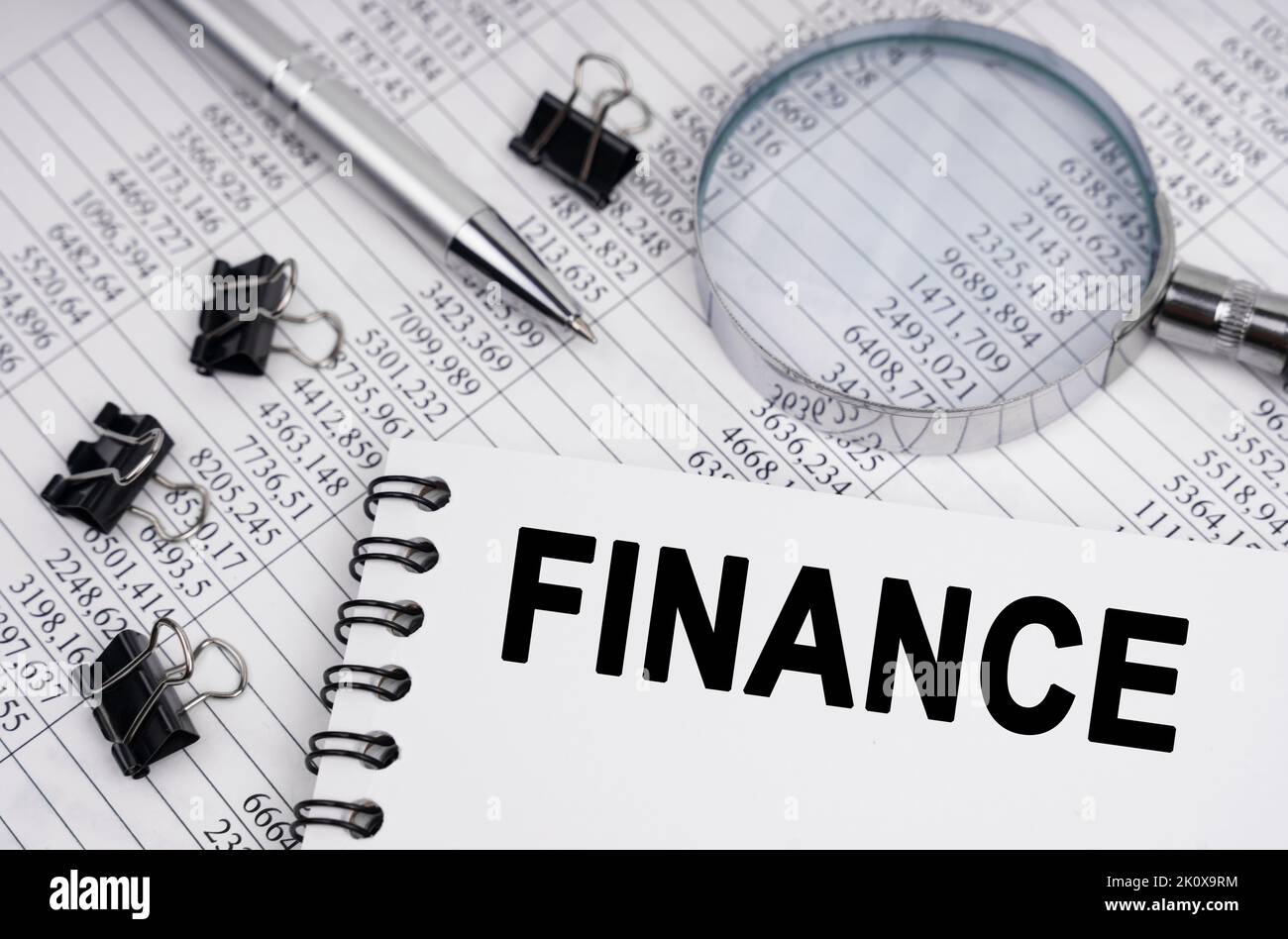 Business and economics concept. On the table is a magnifying glass ...