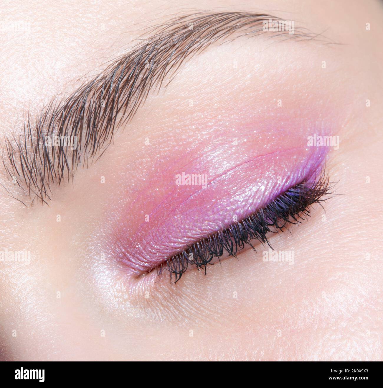 Closeup macro shot of closed human female eye. Woman with natural ...