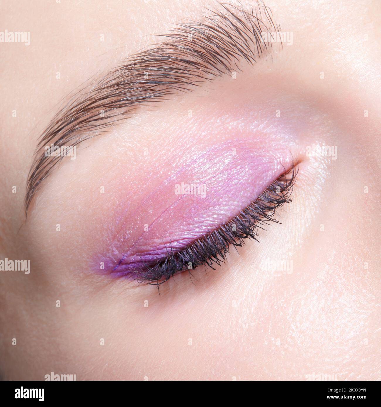 Closeup macro shot of closed human female eye. Woman with natural ...