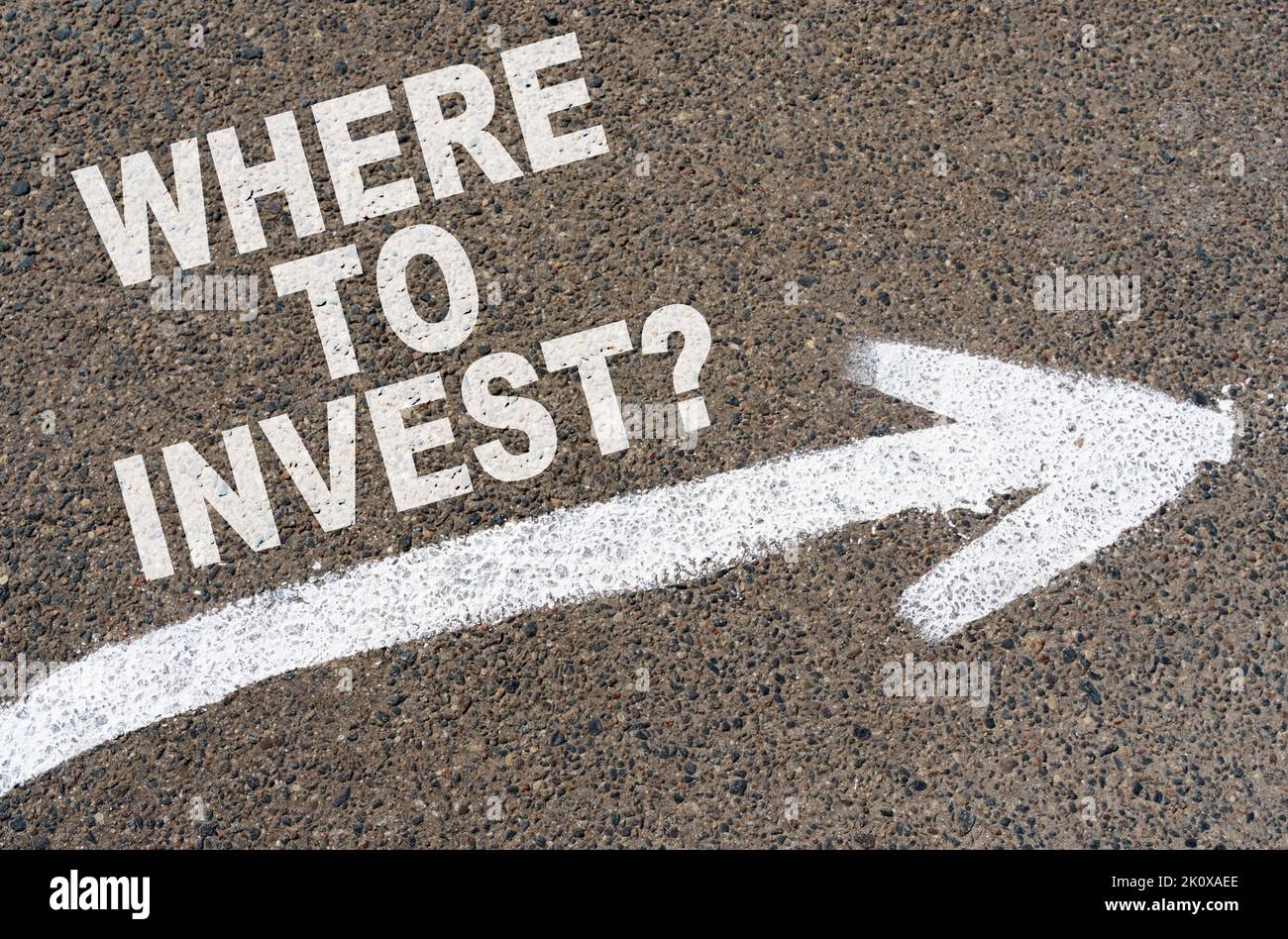 Business concept. On the asphalt road markings an arrow with the ...