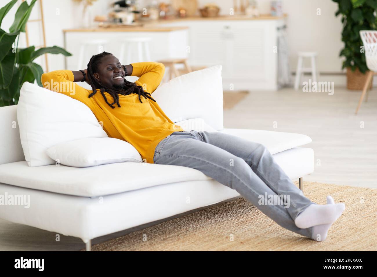 Relaxing Weekend. Smiling Young African American Man Resting On Couch ...