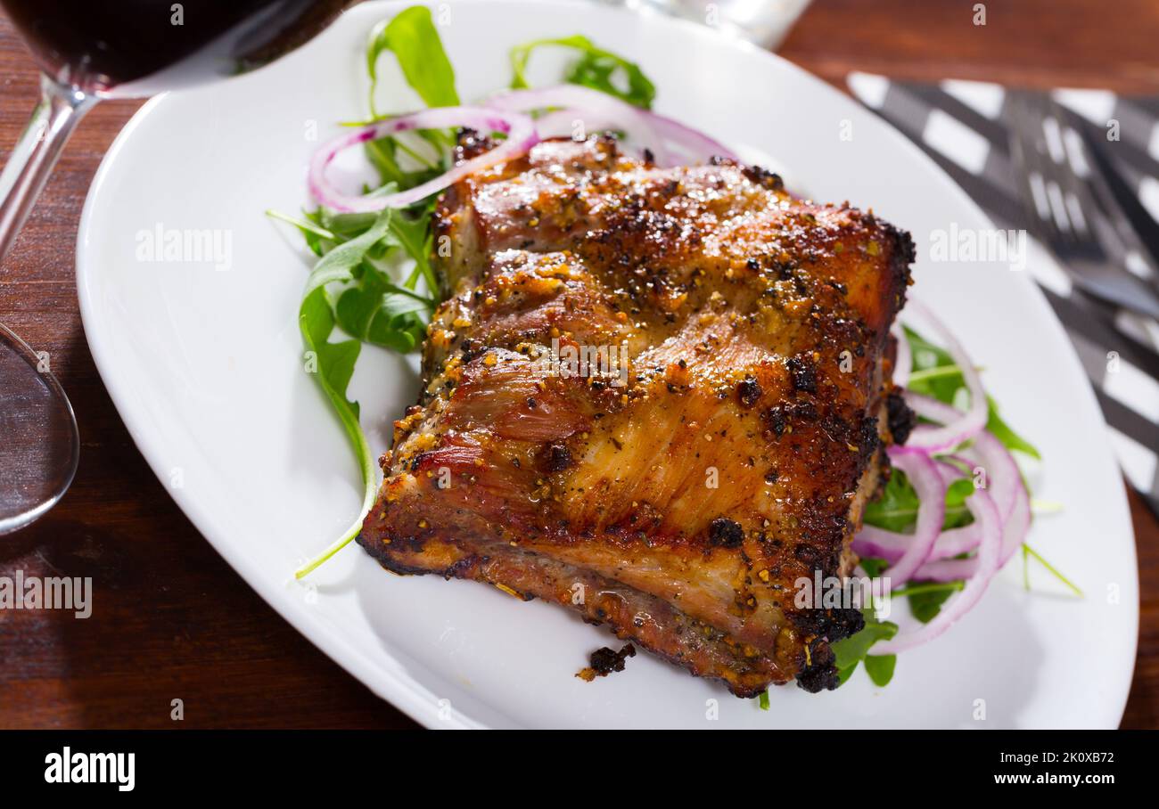 Rack of pork with greens Stock Photo - Alamy