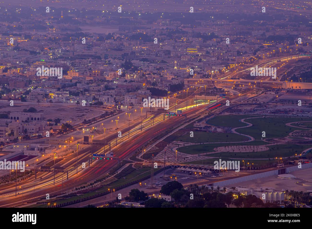 bird eye aerial View of Doha City after sunset.. Doha roads and traffic ...