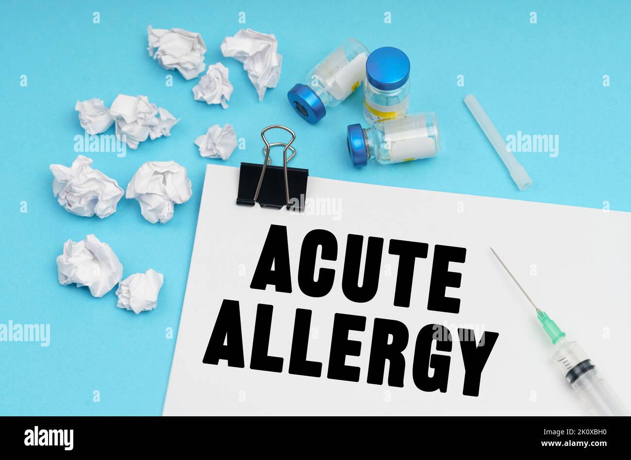 Medicine concept. On a blue background, a syringe, medicine, white ...