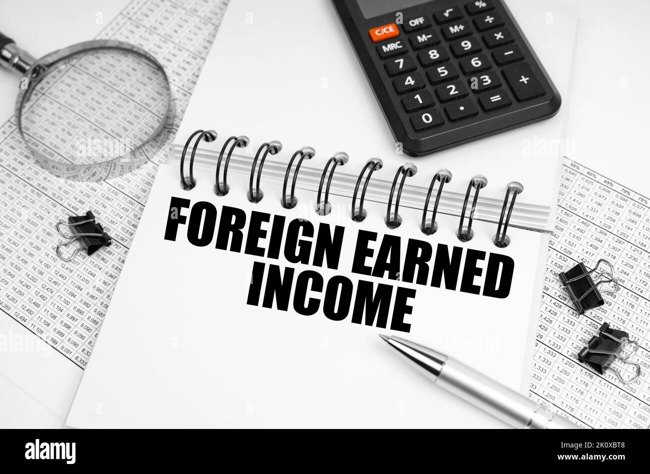 Business and finance concept. On the table is a magnifying glass, a ...