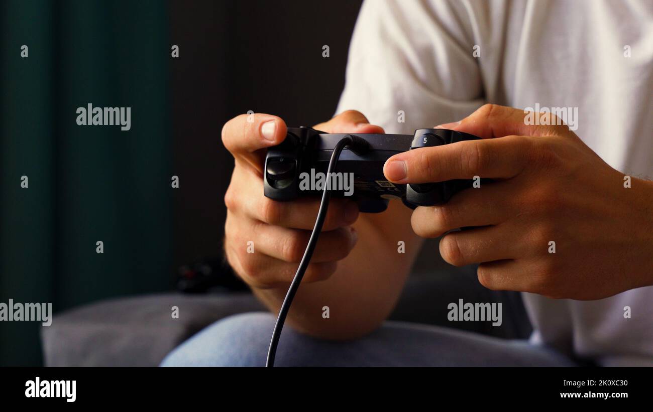 Man holding joystick in both hands Stock Photo - Alamy