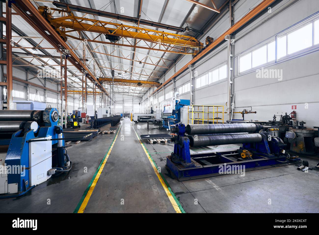 Bending rolls installed in metal sheet processing workshop Stock Photo - Alamy