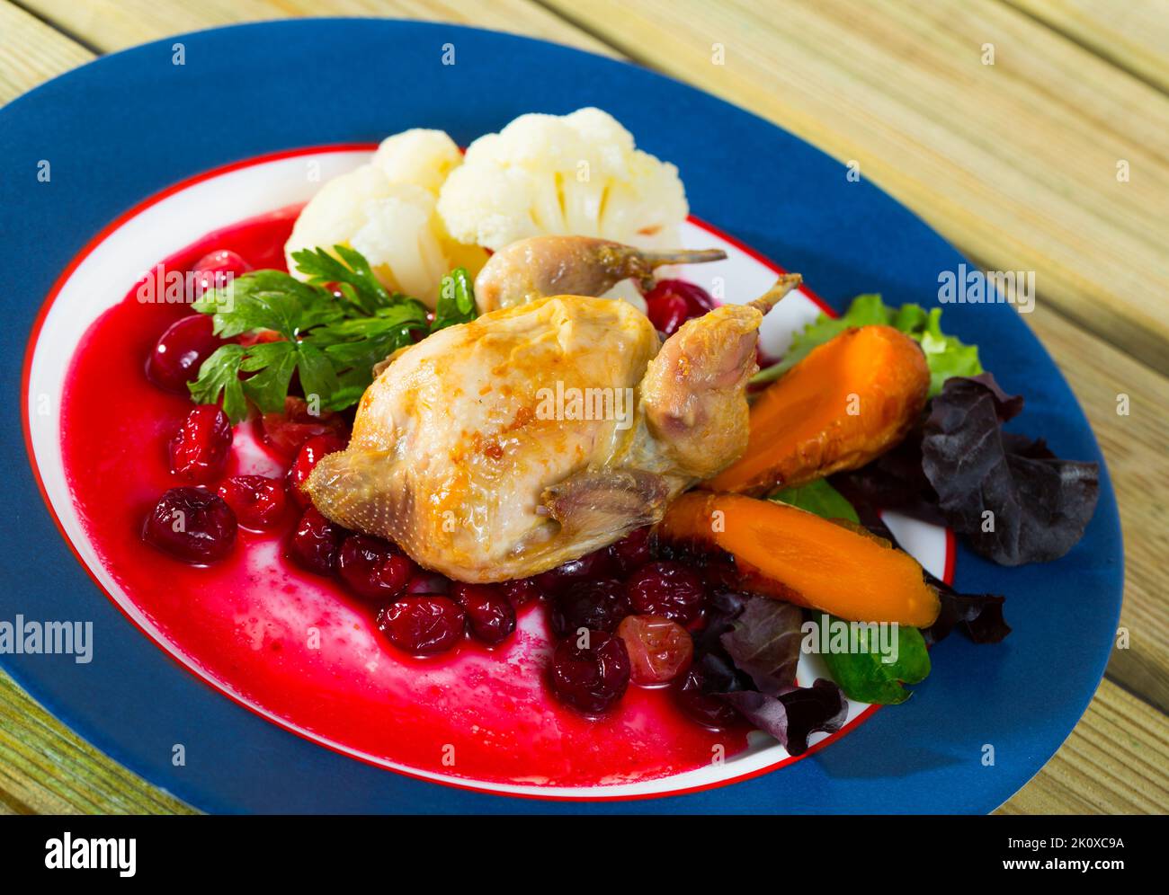 Grilled quail with sauce and vegetables Stock Photo - Alamy