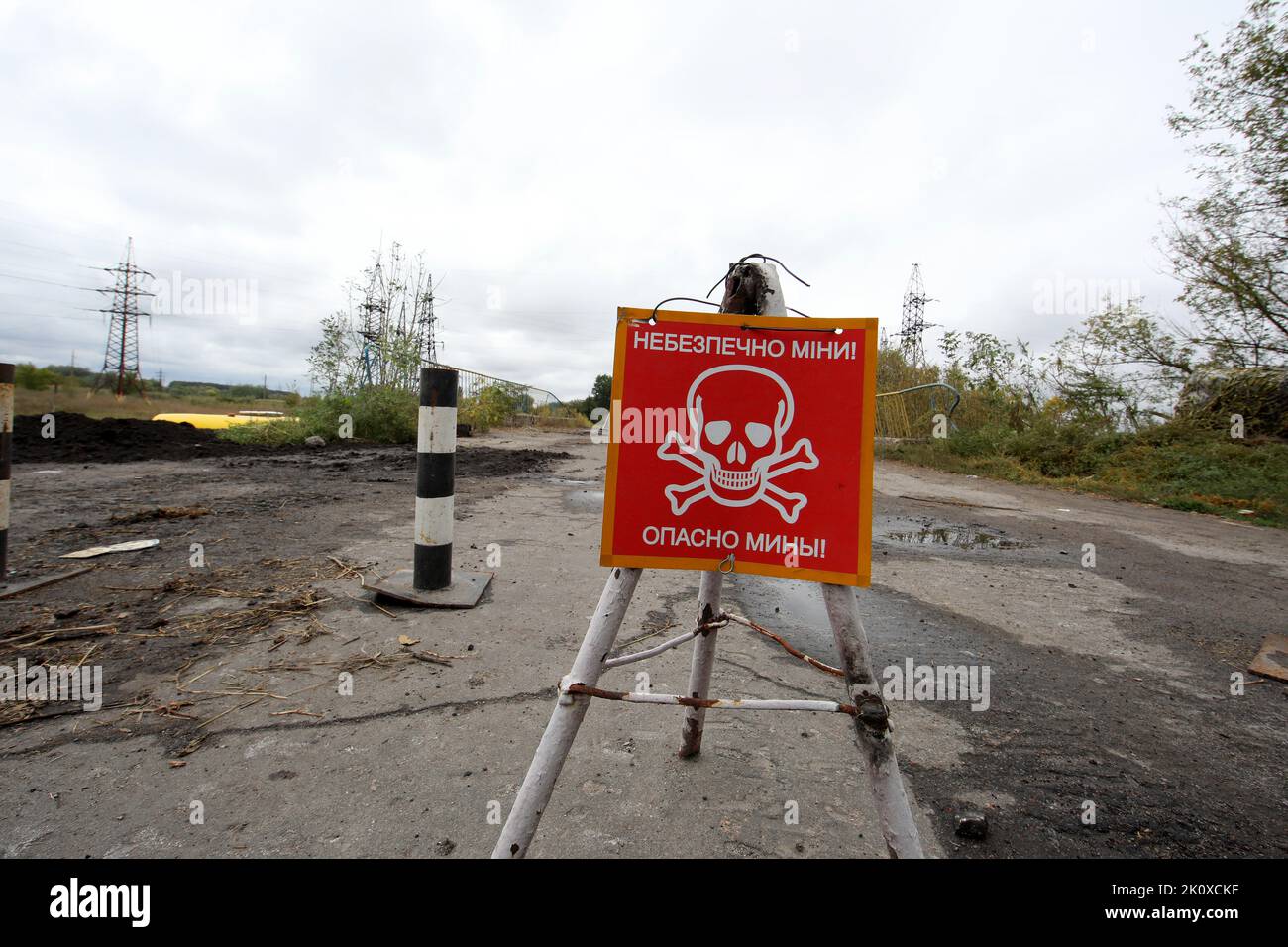 KHARKIV REGION, UKRAINE - SEPTEMBER 13, 2022 - The 'Danger Mines!' sign ...