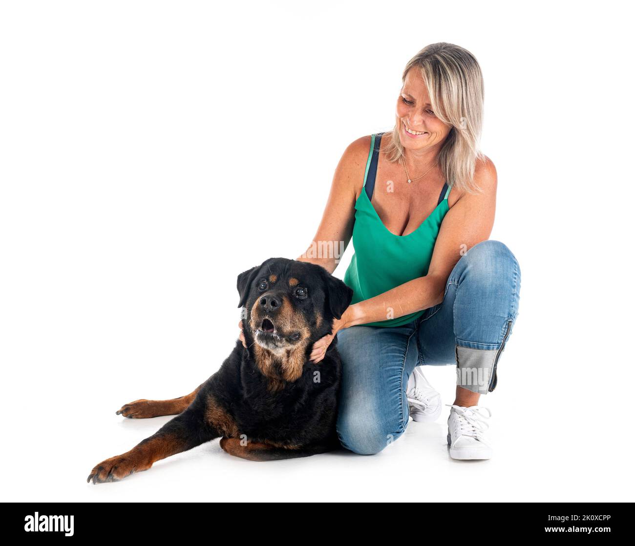 purebred old rottweiler fourteen year and his owner in front of white ...