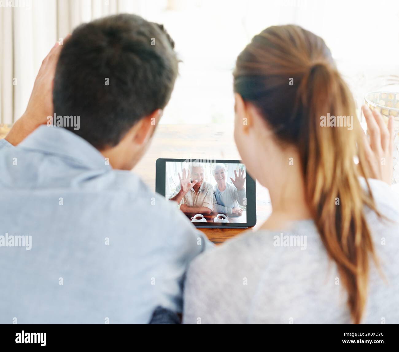 Hi guys Long time...A young couple using a digital tablet for a video ...