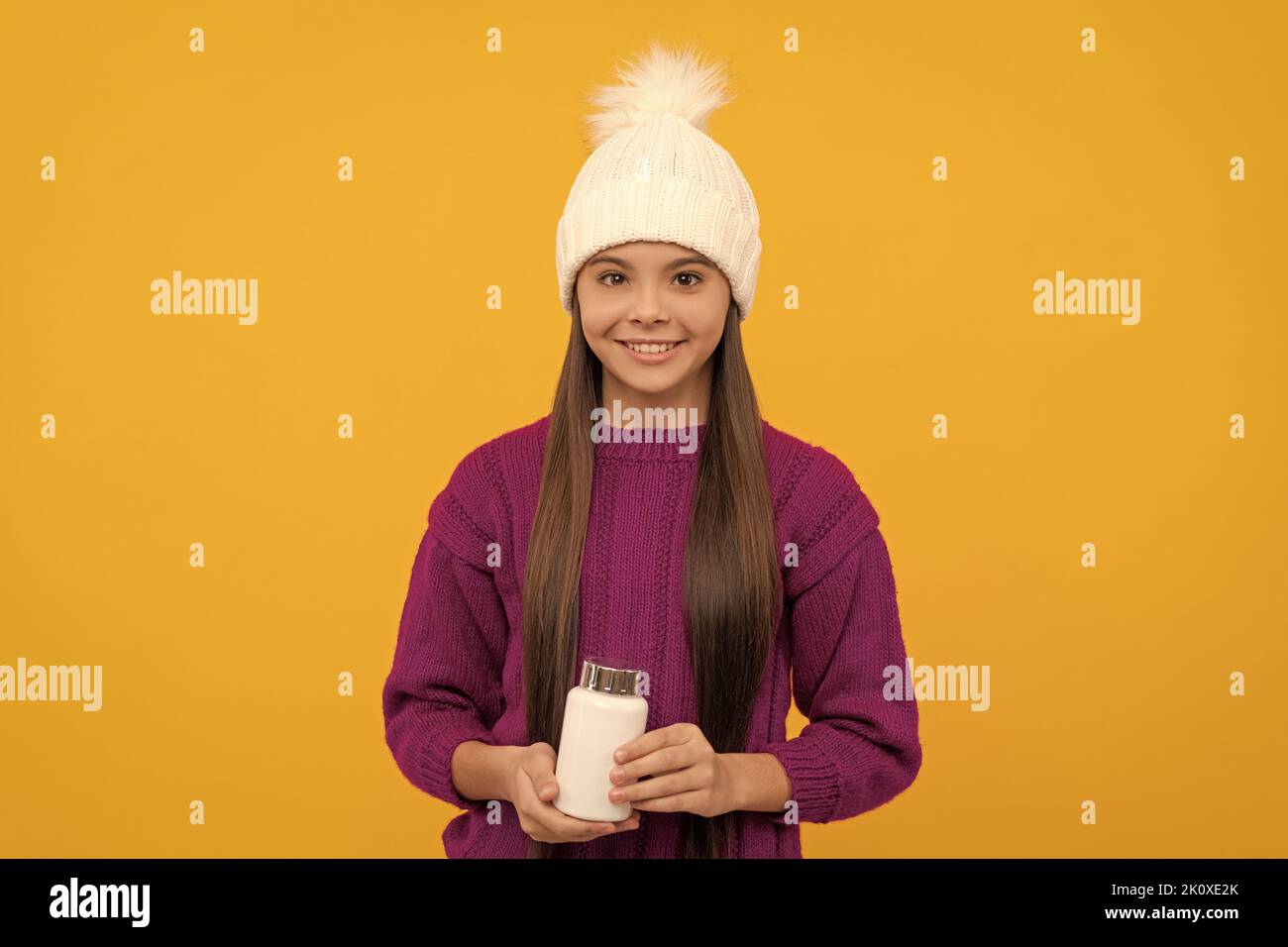happy child in winter hat with pill jar, health Stock Photo - Alamy