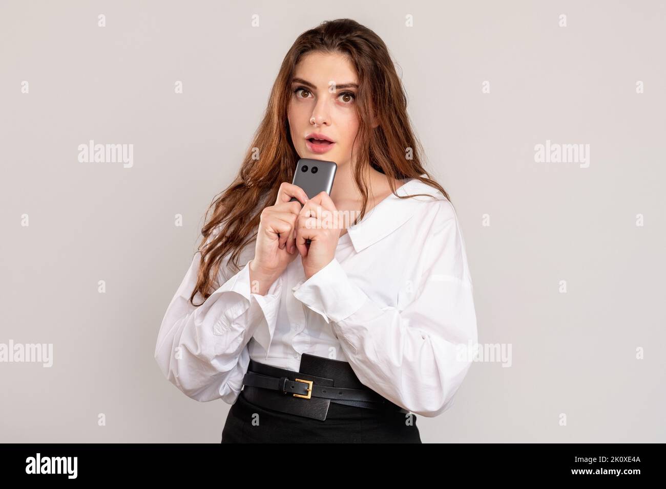 scared woman portrait mobile scam worried phone Stock Photo - Alamy