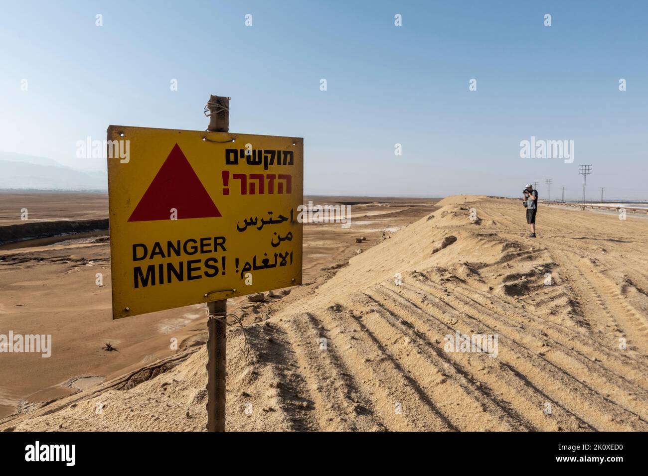 A minefield warning sign placed at the site of a salt wall barrier ...