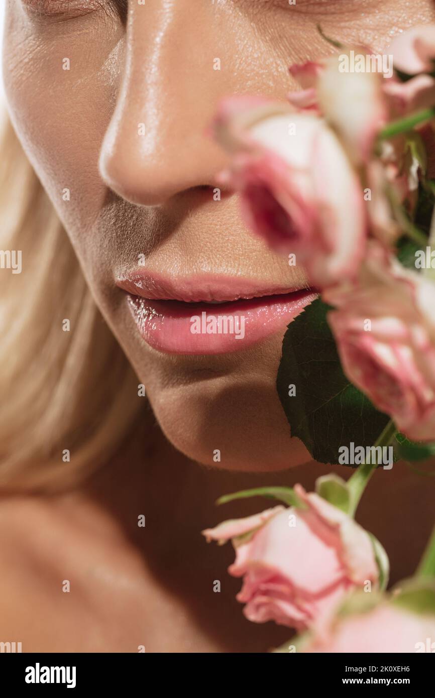 Tender Lips Close Up Of Beautiful Young Woman With Flower Isolated