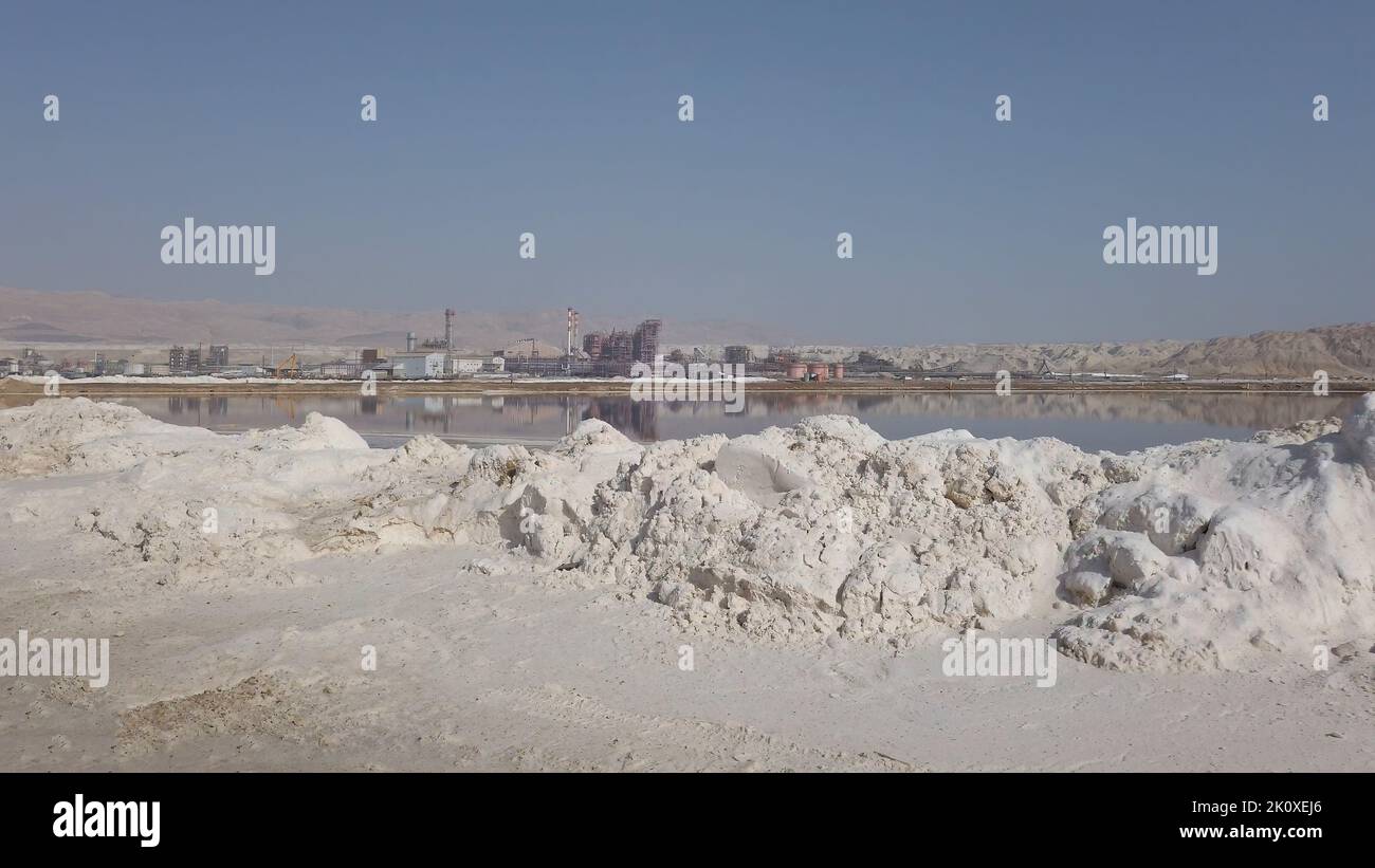 Piles of salt extracted from evaporation pools of the 'Dead Sea Works ...