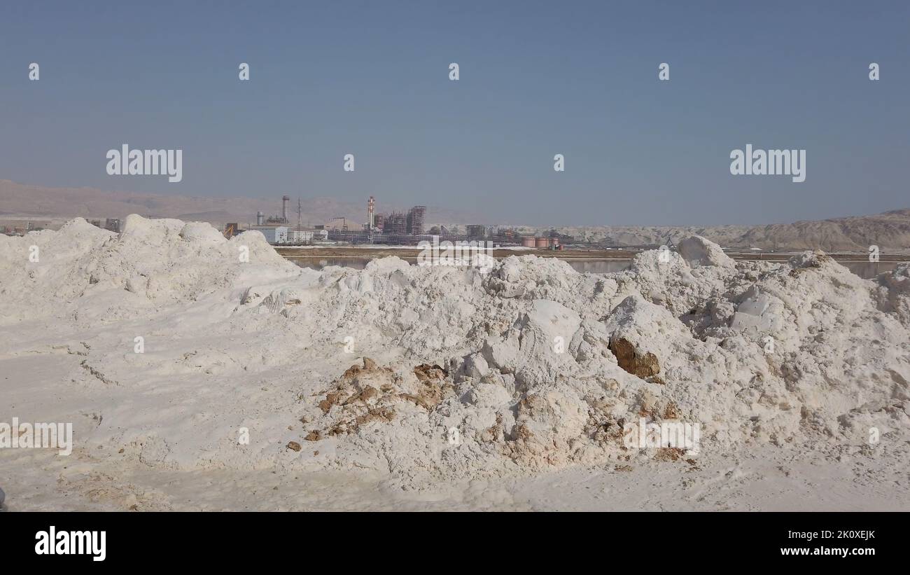 Piles of salt extracted from evaporation pools of the 'Dead Sea Works ...