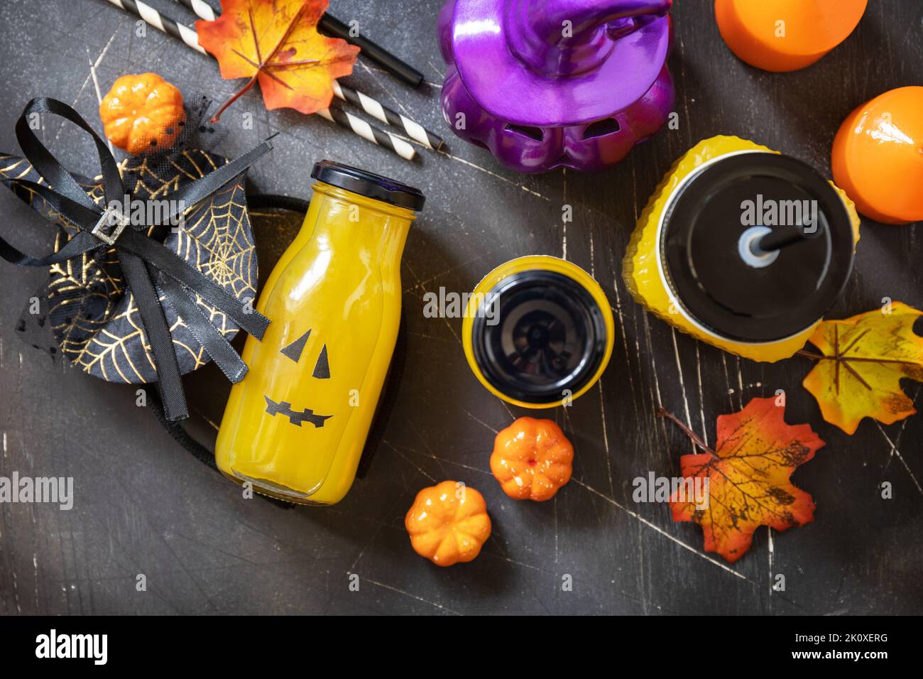 Halloween mocktails. Pumpkin cocktails and lemonade in glass jars ...