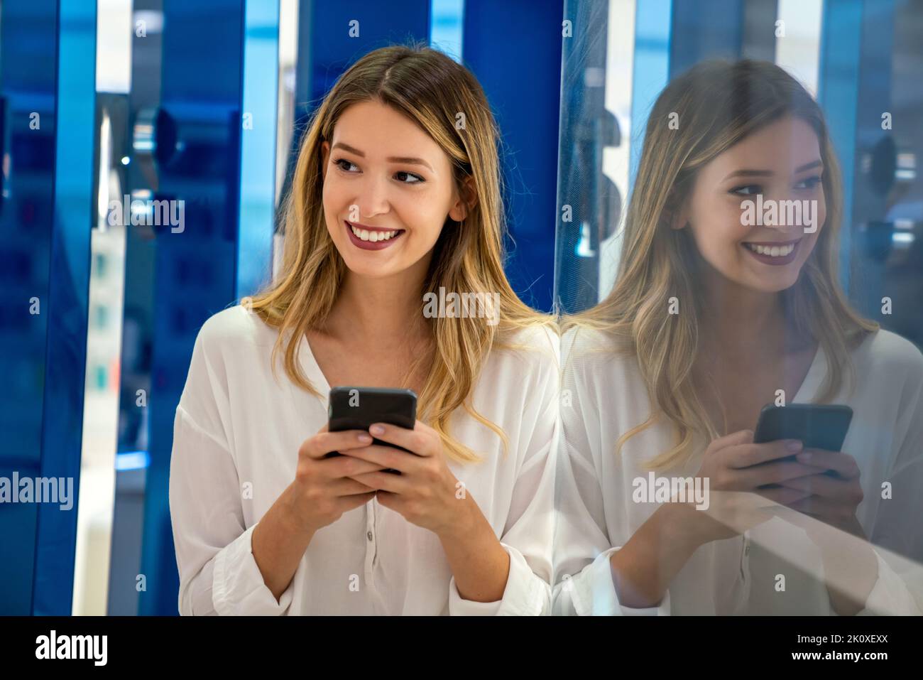 Portrait of happy beautiful smiling business woman using mobile phone ...