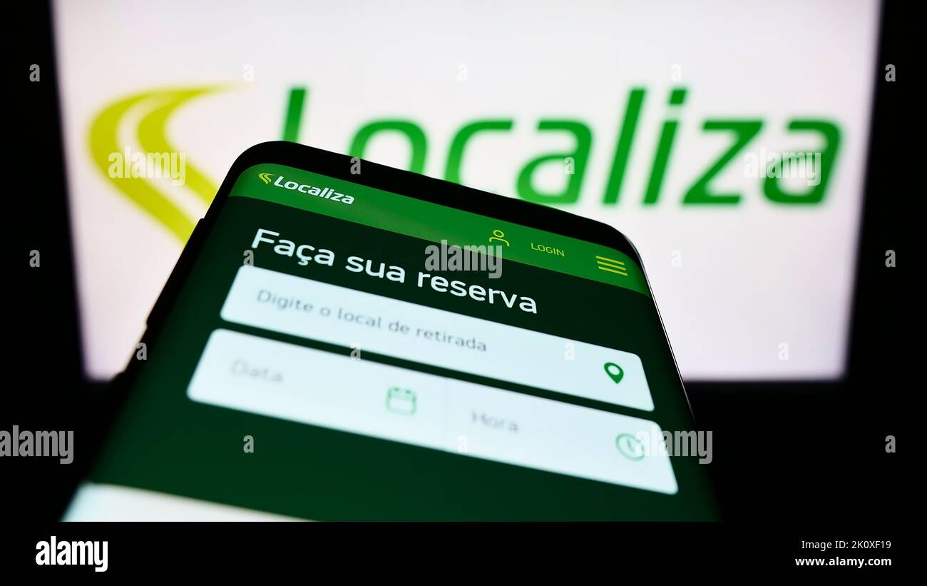 Mobile phone with website of Brazilian company Localiza Rent a Car S.A ...