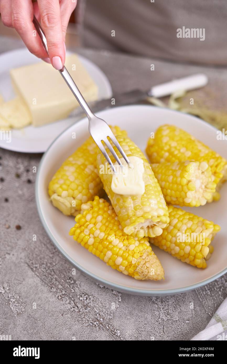 Cooked corn cobs on a plate at domestic kitchen Stock Photo - Alamy