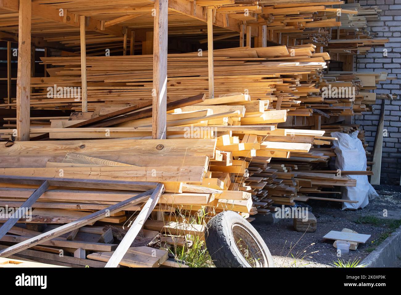 Folded finished boards at the sawmill close up Stock Photo - Alamy
