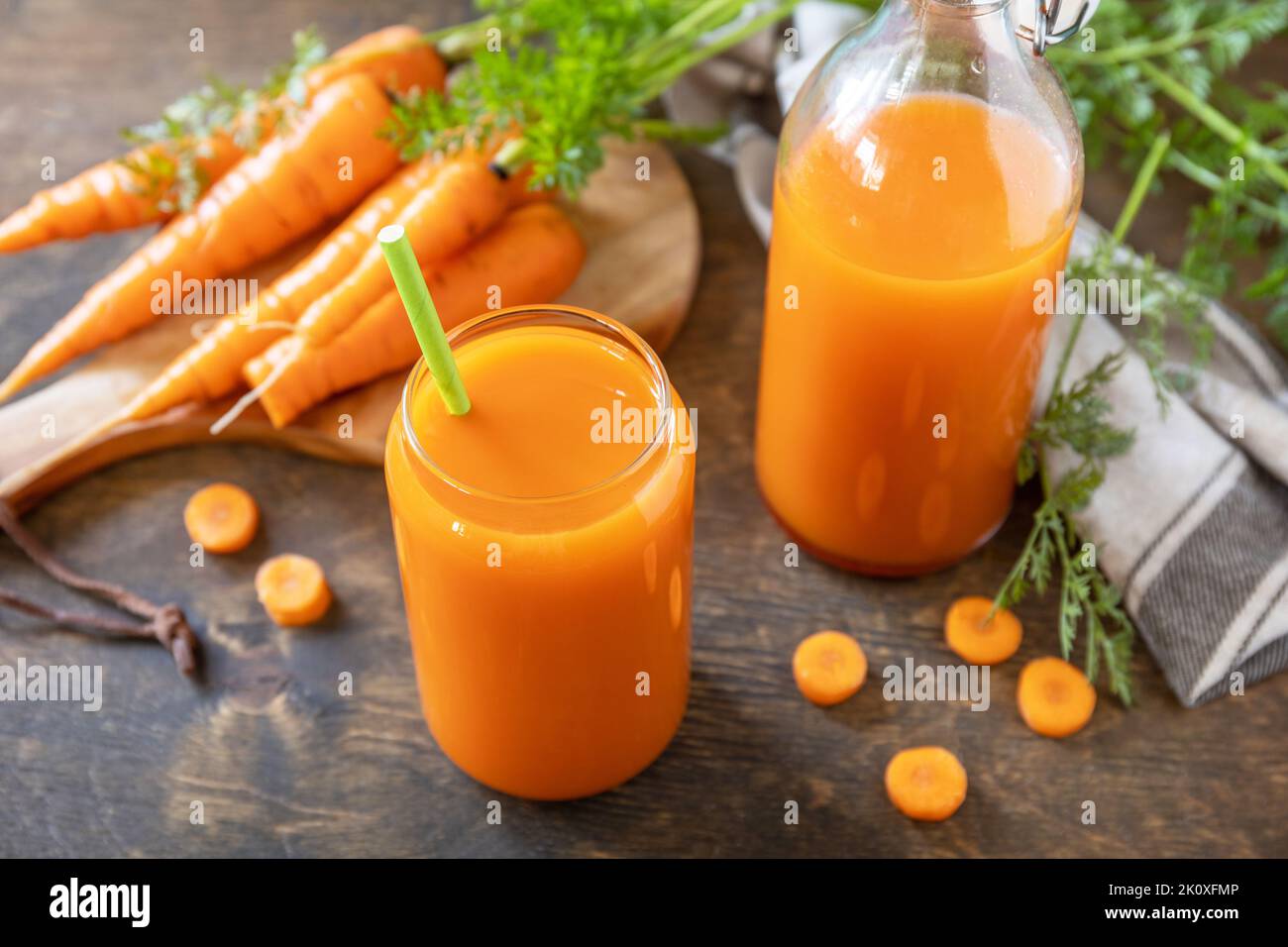 Fresh natural juice, healthy food concept. Glass jar of fresh carrot ...
