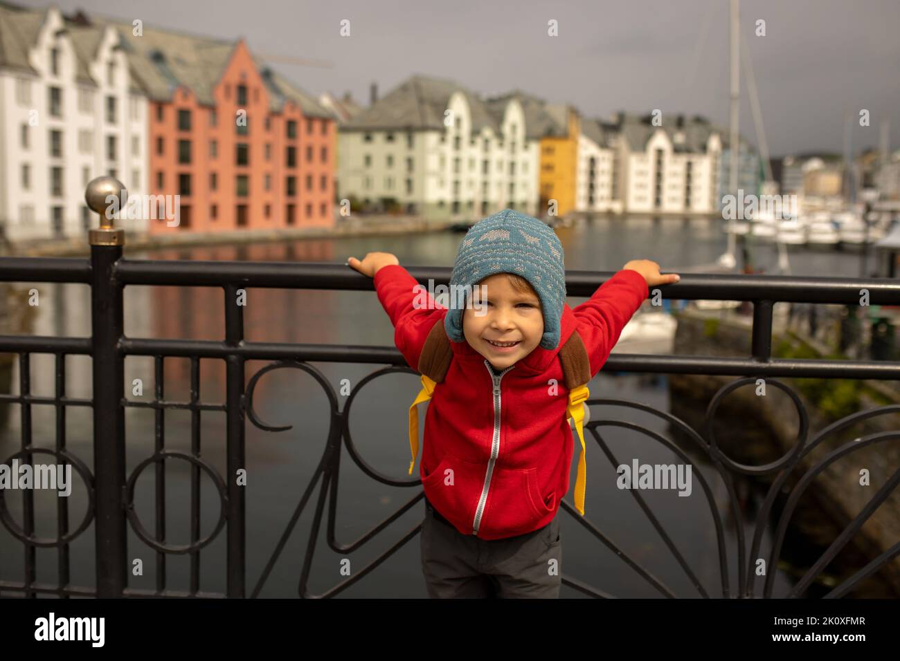 Family, kids, adults and dog, enjoying family vacation in Alesund ...