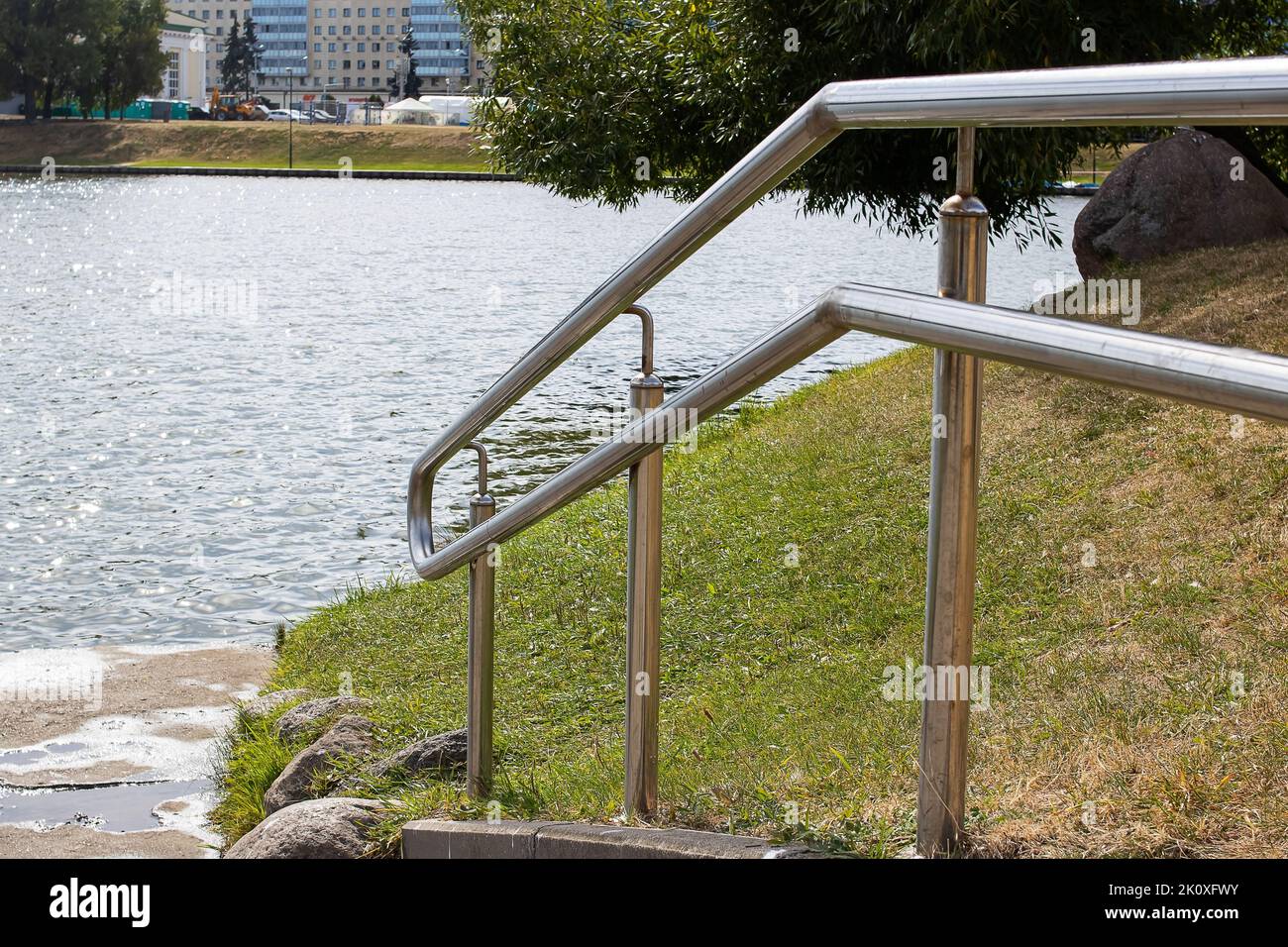 Metal railings at the stairs near the pond close up Stock Photo - Alamy