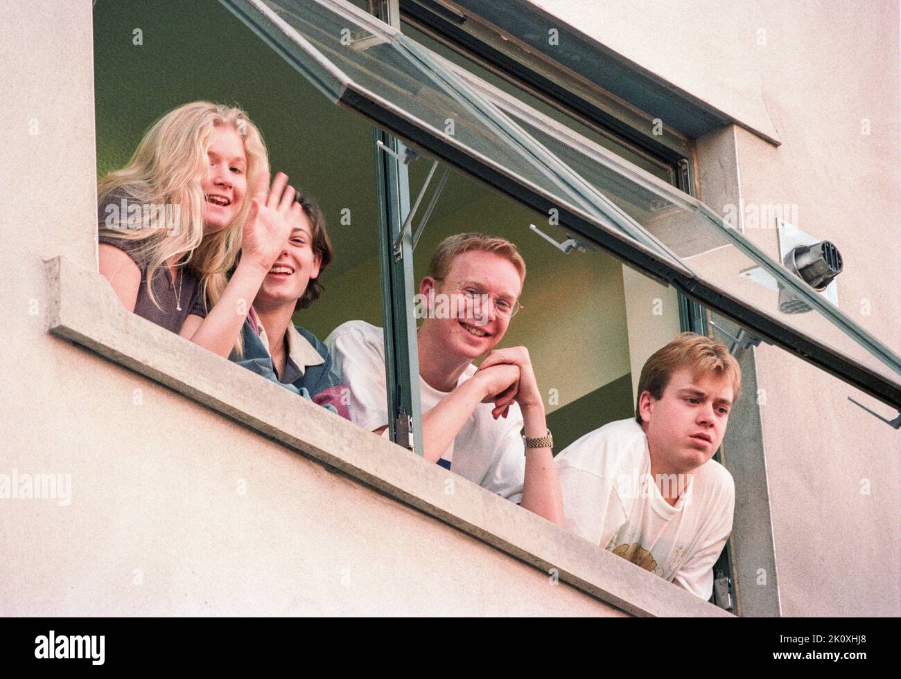 Students try to get a view as Prince Charles, the Prince of Wales ...